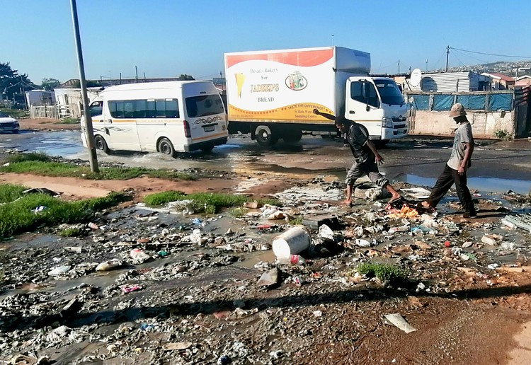 Taxis plough through sewage in Port Elizabeth | GroundUp