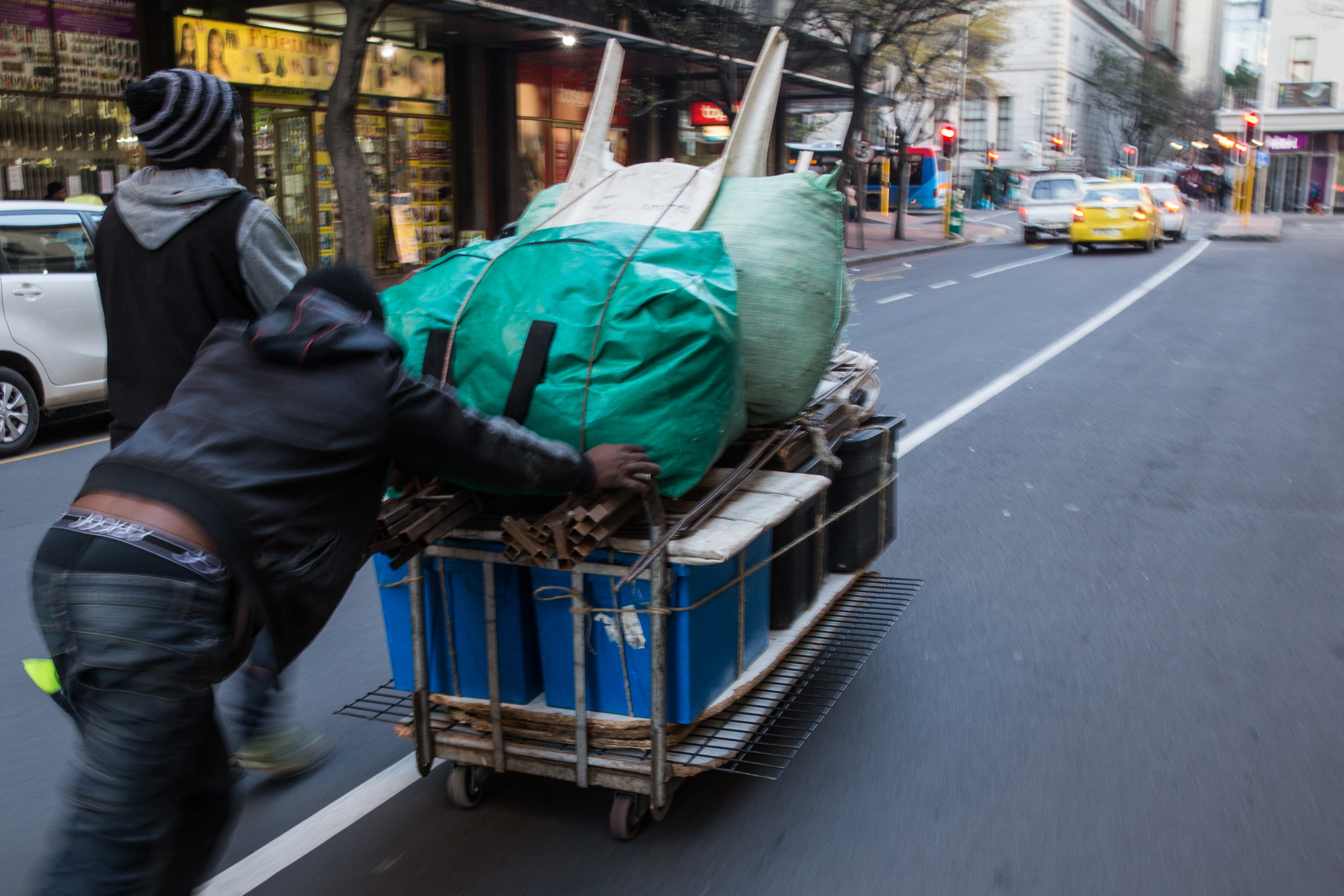Hard work and little pay: pushing heavily-laden trolleys while dodging ...