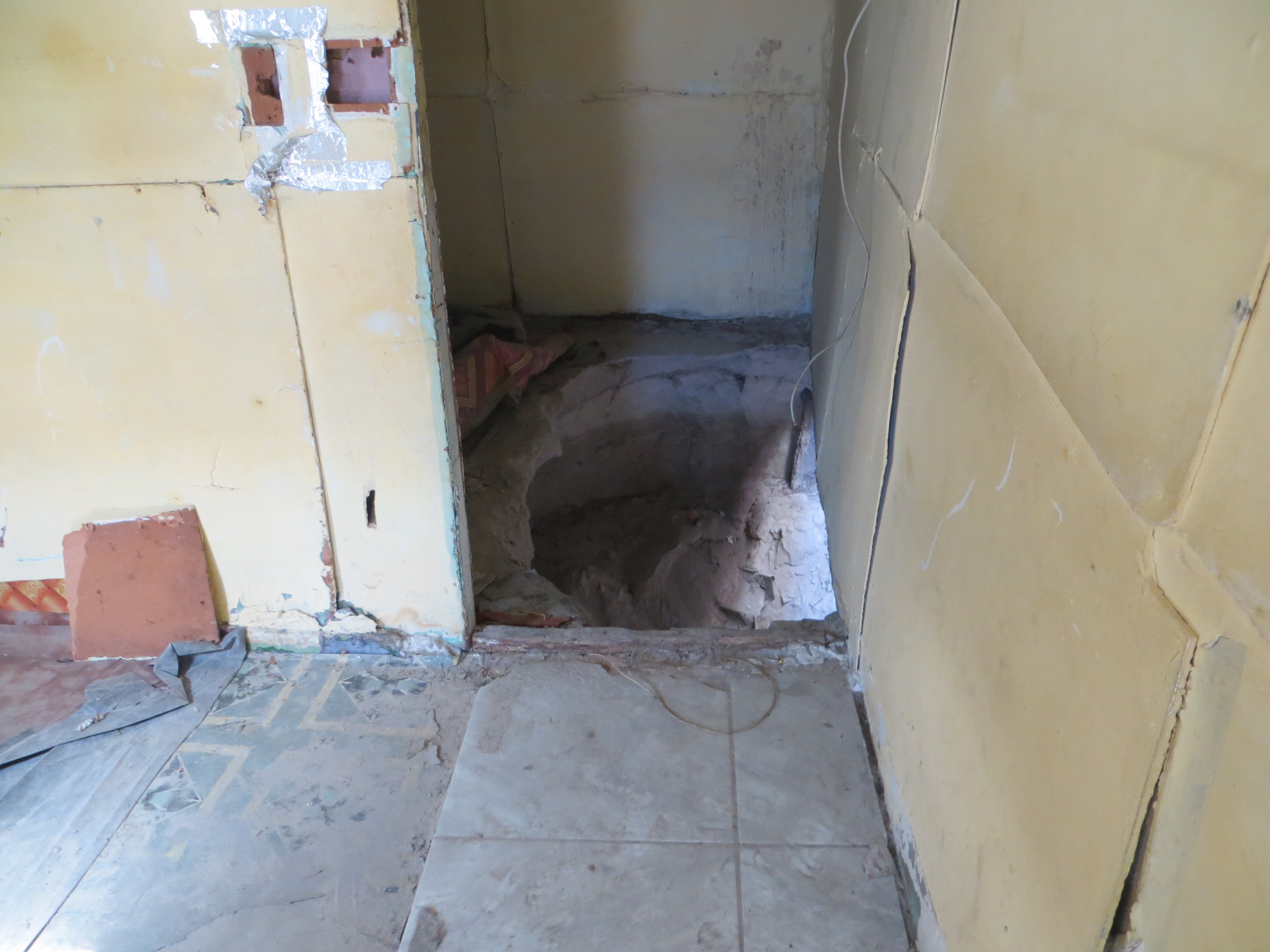 Sinkholes open under Khayelitsha shacks, flooding homes with sewage ...